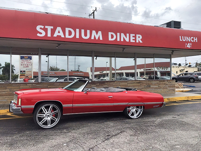 The iconic red awning of Stadium Diner stands out like a beacon for hungry Miamians, promising comfort food that transcends trendy culinary fads.