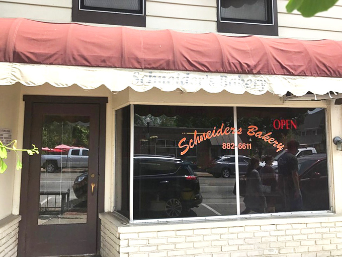 That neon sign might as well say "PARADISE" instead of "OPEN" &ndash; Schneider's storefront has been guiding hungry pilgrims to donut nirvana for generations.
