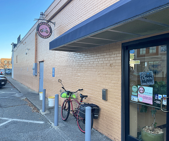 The unassuming yellow brick exterior of Glazed Doughnuts proves once again that culinary treasures often hide in plain sight. That bicycle knows what's up.