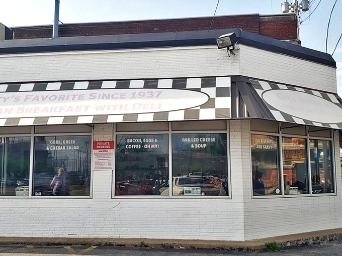 The classic black-and-white checkered awning isn't just decoration&mdash;it's a beacon of breakfast hope for hungry Kansas Citians seeking their morning salvation.