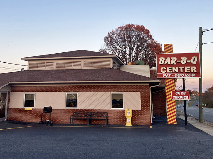 Bathed in sunset light, this no-frills barbecue temple has been drawing pilgrims to Lexington's barbecue altar for decades. The sign says it all: pit-cooked perfection awaits.