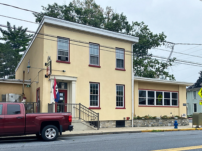 The exterior of Harvey&rsquo;s Main Street BBQ, marked by its vintage sign, carries a timeless charm that feels like a secret handshake for barbecue aficionados.