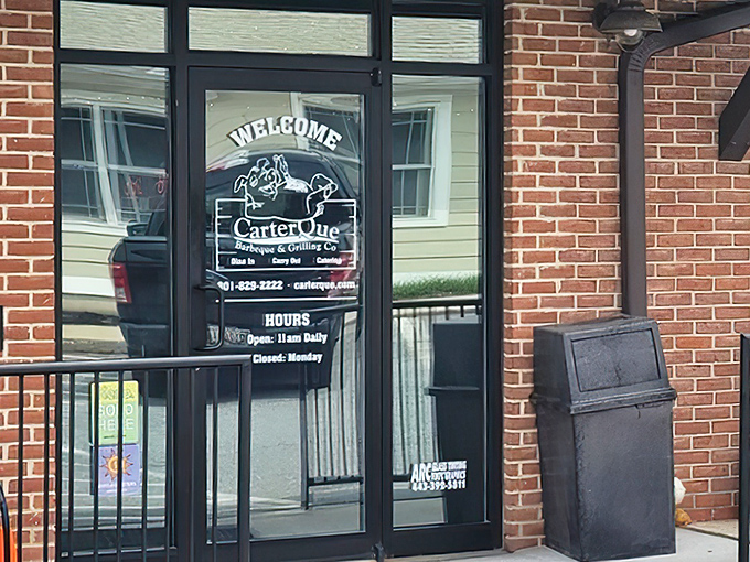 The unassuming entrance to barbecue paradise. Behind this glass door, smoke-kissed treasures await the hungry traveler.