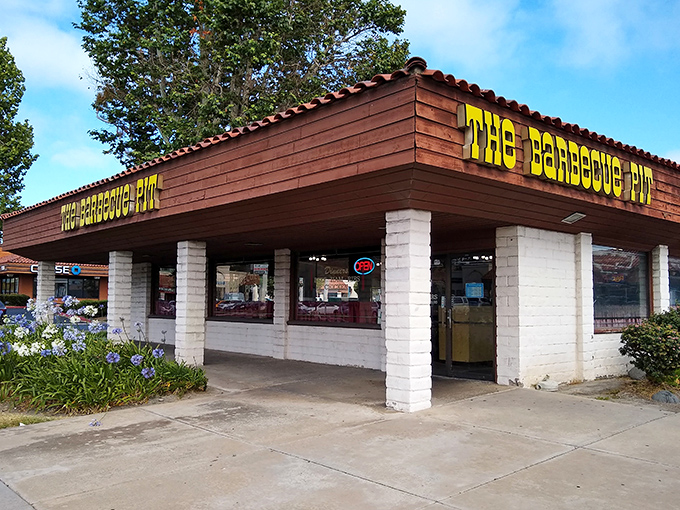 The unassuming exterior of The Barbecue Pit stands as a testament that culinary greatness doesn't need flashy signage&mdash;just decades of smoke-infused expertise.