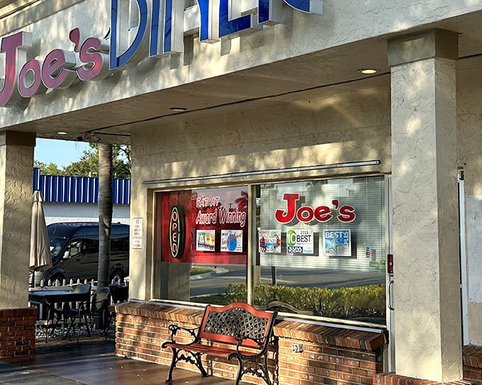 The unassuming storefront of Joe's Diner might not scream "culinary destination," but locals know this Naples treasure hides breakfast magic behind those brick walls.