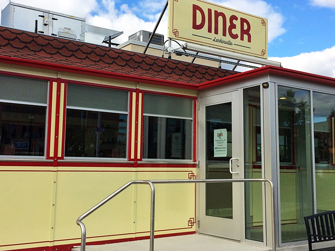 That butter-yellow exterior with red trim isn't just charming—it's a beacon calling you home to breakfast.