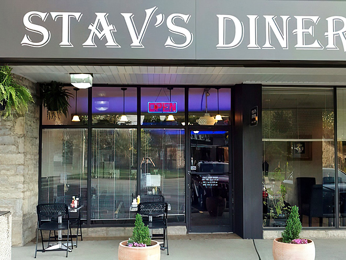 The welcoming storefront of Stav's Diner beckons with its classic signage and cozy outdoor seating&mdash;a Columbus breakfast sanctuary hiding in plain sight.