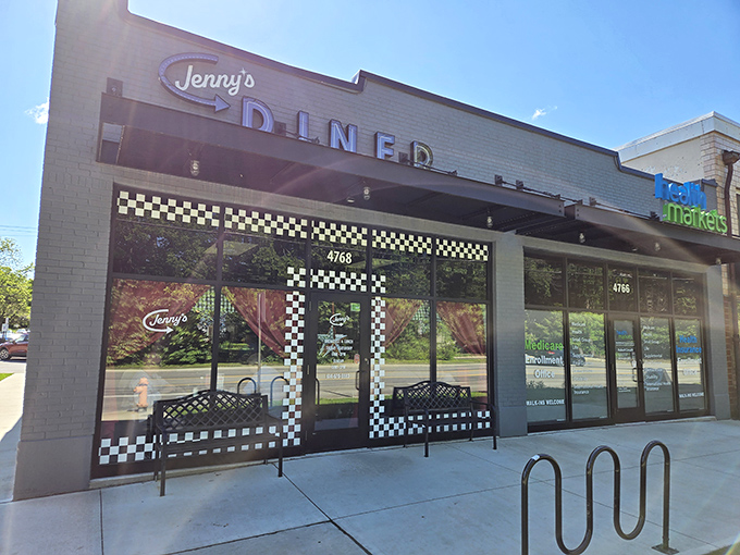The iconic checkered pattern frames Jenny's storefront like a finish line flag, signaling you've arrived at your culinary destination.