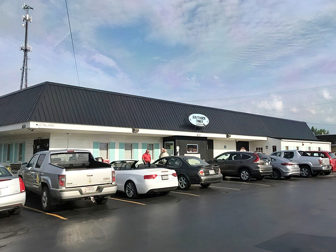 Classic cars and a blue sign welcome you to Southside Diner, where automotive nostalgia meets breakfast perfection in Mt. Vernon's hidden gem.