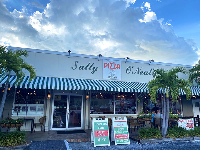 The iconic blue and white striped awnings of Sally O'Neal's welcome you like an old friend who happens to make incredible pizza.