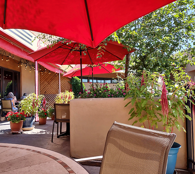 Santa Fe sunshine meets culinary comfort under those vibrant red umbrellas. The patio at Joe's invites you to linger over coffee and conversation.