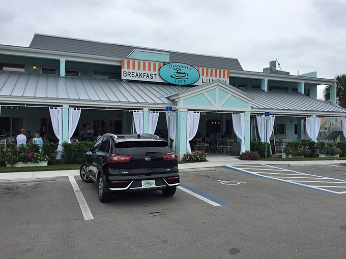 The turquoise facade of Doreen's Cup of Joe stands like a beacon of breakfast hope on Marco Island, promising morning salvation one waffle at a time.
