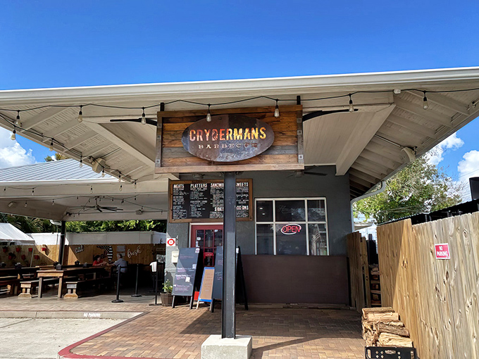 The rustic wooden sign and covered patio welcome you like an old friend with a smoky secret to share.