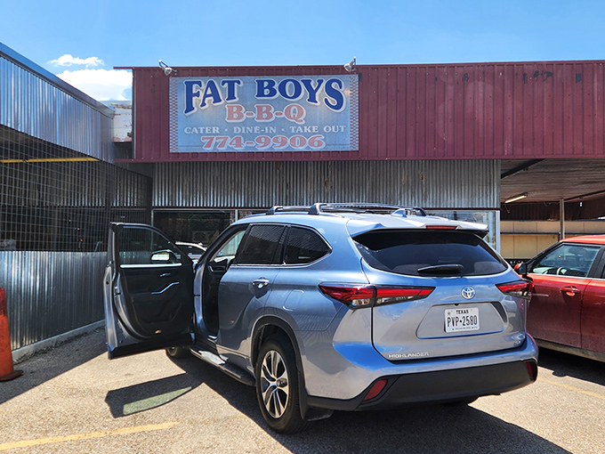 The unassuming exterior of Fat Boy's BBQ stands as a beacon of hope for hungry travelers &ndash; proof that Texas BBQ greatness often hides in plain sight.