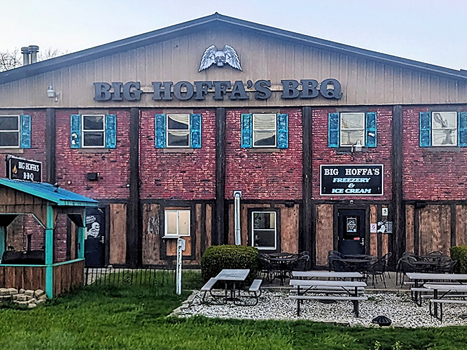 The unassuming brick-and-wood exterior of Big Hoffa's BBQ stands like a barbecue beacon in Westfield, promising smoky treasures within.