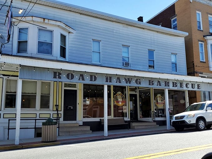 The unassuming storefront of Road Hawg Barbecue proves once again that the best barbecue joints rarely need flashy exteriors to announce their smoky treasures within.