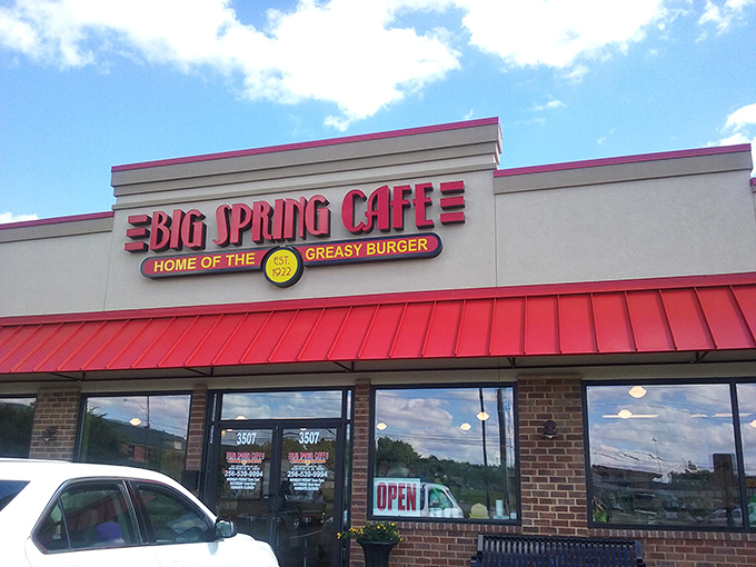 The bright red awning of Big Spring Cafe beckons like a beacon for burger lovers. Huntsville's oldest restaurant doesn't need fancy architecture to draw crowds.