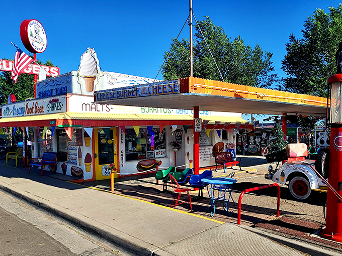 The technicolor dream coat of roadside diners! Delgadillo's Snow Cap stands proudly on Route 66, promising burgers, laughs, and a splash of Americana.