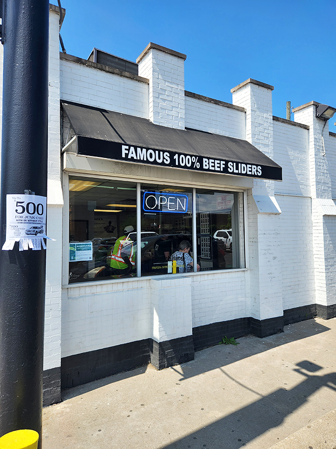 The unassuming white brick facade of Motz's hides culinary greatness like Clark Kent's glasses hide Superman. Famous 100% beef sliders await inside.