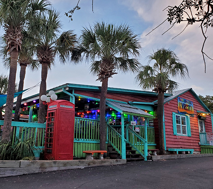 The coral-pink exterior with turquoise trim isn't just a building&mdash;it's a mood announcement. Beach vibes and burger dreams await!