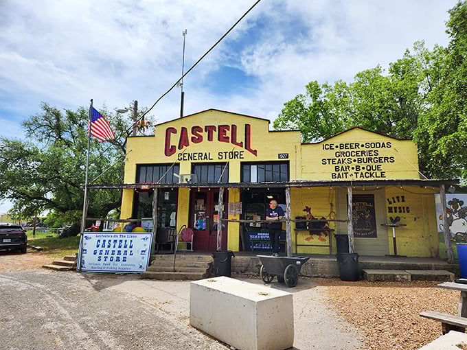 The bright yellow facade of Castell General Store stands like a beacon of hope for hungry travelers, promising authentic Texas charm and satisfying meals ahead.