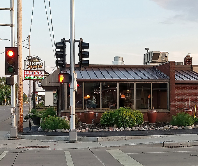 The unassuming exterior hides culinary treasures within, like finding a Picasso at a garage sale. Those yellow bollards stand guard over breakfast paradise.