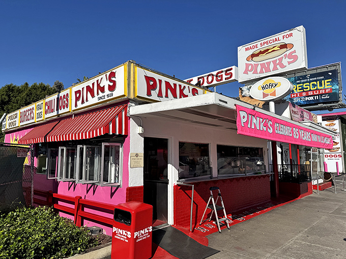 That iconic pink building with red-and-white awnings isn't subtle, but neither is your hunger when you spot Pink's from a block away.