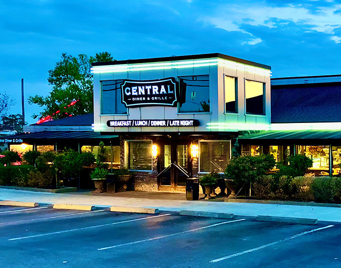 The blue-hour glow transforms this unassuming diner into a beacon of culinary promise. Like finding a Rolex in your cereal box&mdash;unexpected treasure awaits inside.