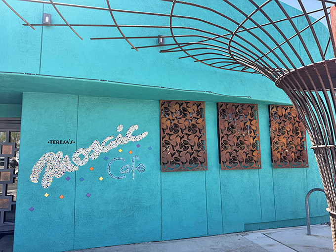 That turquoise exterior isn't just a building—it's a promise of the vibrant flavors waiting inside Teresa's Mosaic Cafe. The architectural equivalent of a dinner bell.
