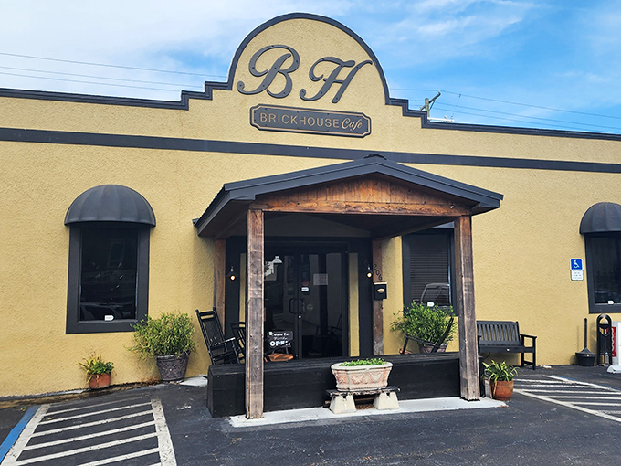 The sunny yellow exterior of Brick House Cafe stands out like a beacon of hope for hungry travelers in Plant City, promising comfort food salvation inside.