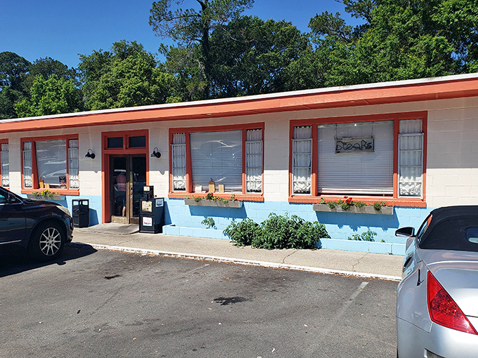 The unassuming exterior of Steffens Restaurant proves once again that culinary treasures often hide behind modest facades. Those orange-trimmed windows are practically winking at you.