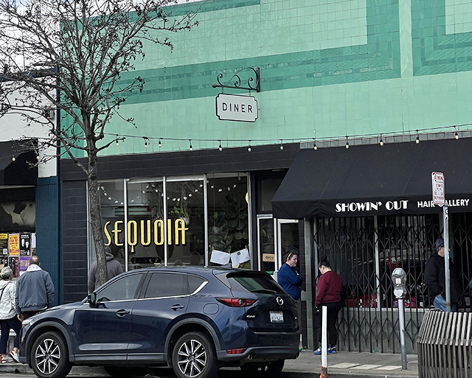 That mint green tile facade isn't just retro-cool &ndash; it's a beacon calling hungry souls to breakfast nirvana.