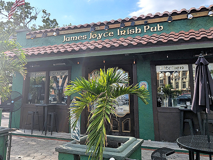 The emerald facade of James Joyce Irish Pub welcomes visitors with sun-shimmering exterior details&mdash;where Ireland meets Florida in this cultural crossroads.