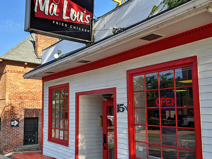 The white clapboard building with bold red trim isn't just eye-catching&mdash;it's a beacon for fried chicken pilgrims seeking salvation in crispy, juicy form.