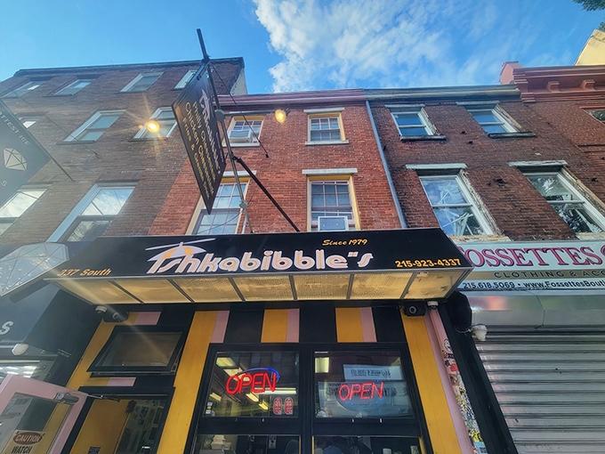 With its playful stripes and glowing neon, Ishkabibble&rsquo;s bright South Street facade has been luring cheesesteak lovers in since 1979.