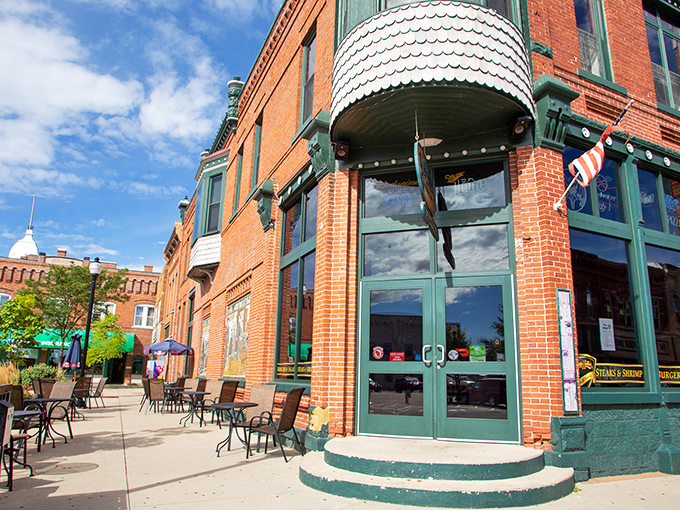 Graffiti's corner entrance beckons like an old friend, its distinctive brick facade and scalloped awning promising refuge from both hunger and Wisconsin weather.