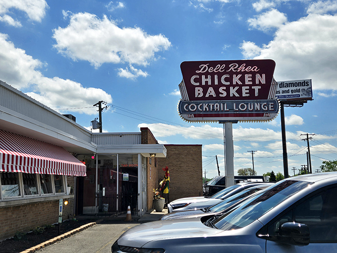 That vintage neon sign beckons like a beacon of fried chicken salvation along Route 66's legendary path.