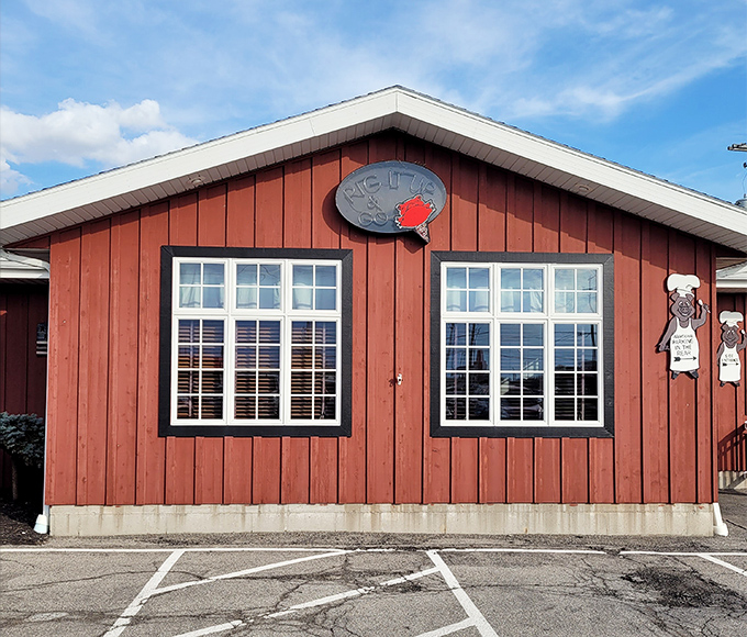 The unassuming exterior of Red Pig Inn proves once again that the best barbecue joints don't need fancy facades&mdash;just a welcoming bench and the promise of smoky delights within.