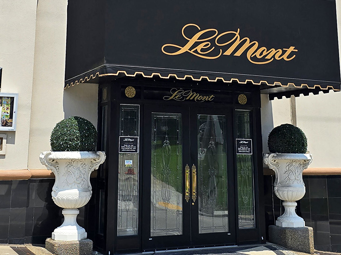 Le Mont's elegant exterior promises what awaits inside &ndash; a navy blue awning and classic architecture that whispers, "Yes, tonight is special."