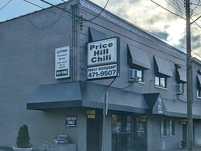 The unassuming brick exterior of Price Hill Chili &ndash; where Cincinnati's culinary magic happens without fanfare or pretension.
