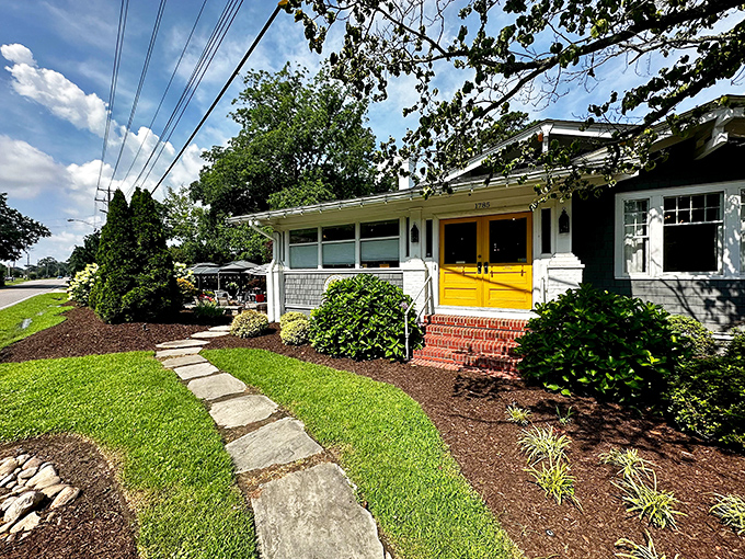 Those cheerful yellow doors aren't just an entrance &ndash; they're a promise of the breakfast bliss waiting inside this charming Virginia Beach cottage.