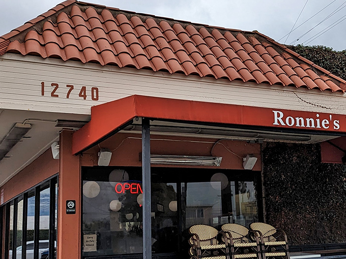 The Spanish-tiled roof and coral-colored awning of Ronnie's isn't trying to impress anyone&mdash;and that's precisely why it does.