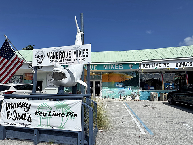 The vibrant exterior of Mangrove Mike's welcomes you with a mural that's pure Florida Keys&mdash;where breakfast dreams and underwater scenes collide in technicolor splendor.