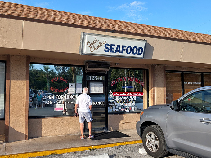 The unassuming storefront of Captain Charlie's hides culinary treasures like a pirate concealing his most precious bounty.