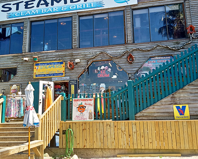 Weathered wood, turquoise stairs, and that iconic blue sign – Steamers doesn't need fancy frills when the seafood inside speaks this eloquently.