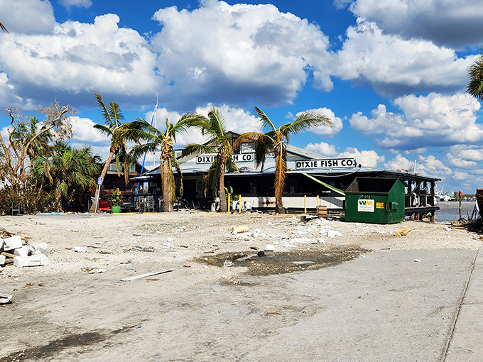 Perched over azure waters like a maritime mirage, this weathered beauty promises culinary treasures worth the journey.