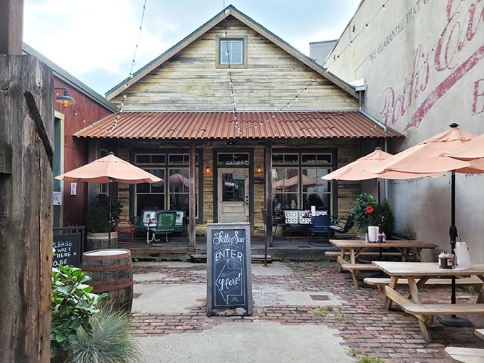 Rustic charm meets urban cool at Fette Sau's weathered wooden exterior. Those picnic tables practically whisper "sit down and stay awhile."