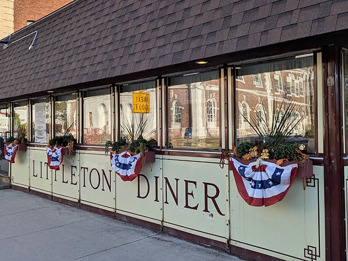 The Littleton Diner's mint-green exterior with patriotic bunting isn't trying to impress anyone&mdash;it's too busy perfecting what's inside. Classic New Hampshire charm at its finest.