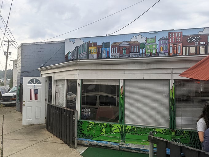 The unassuming exterior of Barb's Corner Kitchen, with its colorful Pittsburgh rowhouse mural, proves that culinary treasures often hide in plain sight.