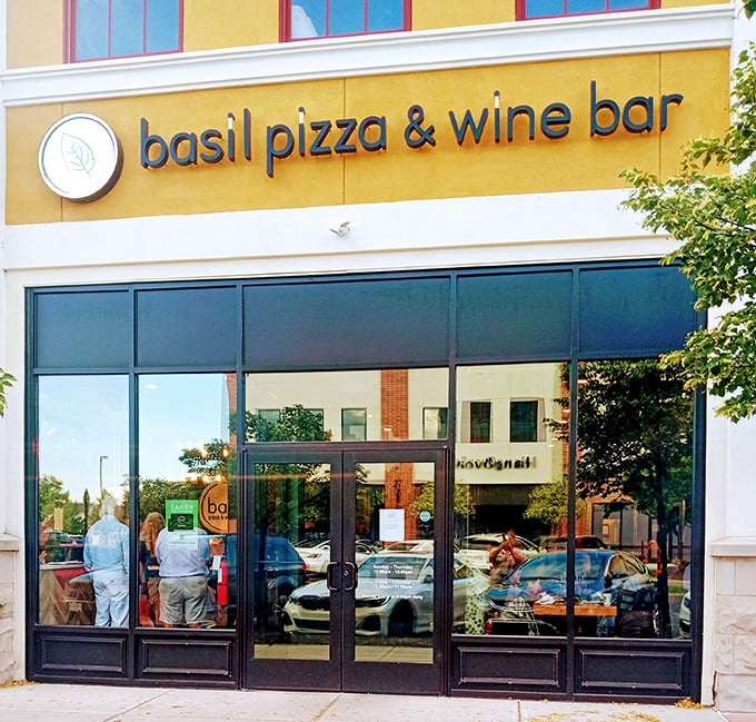 The golden facade of Basil Pizza & Wine Bar beckons like a culinary lighthouse on Perrysburg's main street, promising Italian delights within.